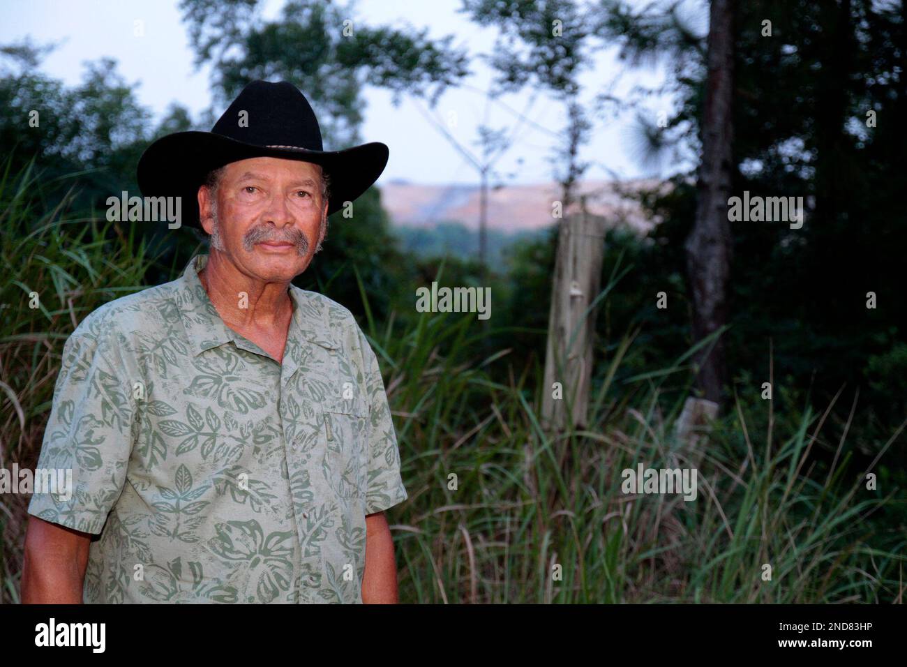 In this photo taken Aug. 6, 2010, Lawrence Andry stands along the road ...