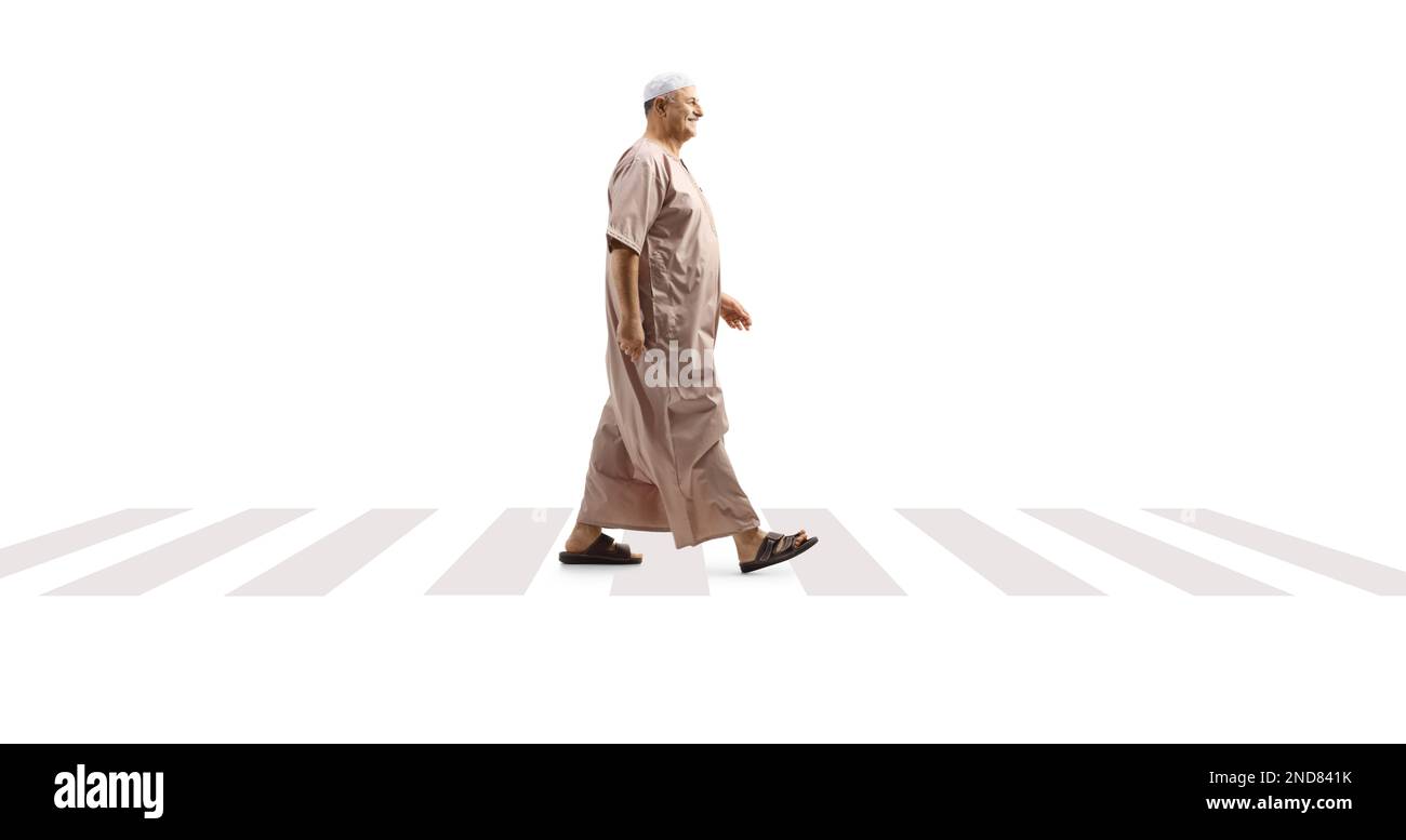 Full length profile shot of a mature arab man in ethinc clothes walking ...