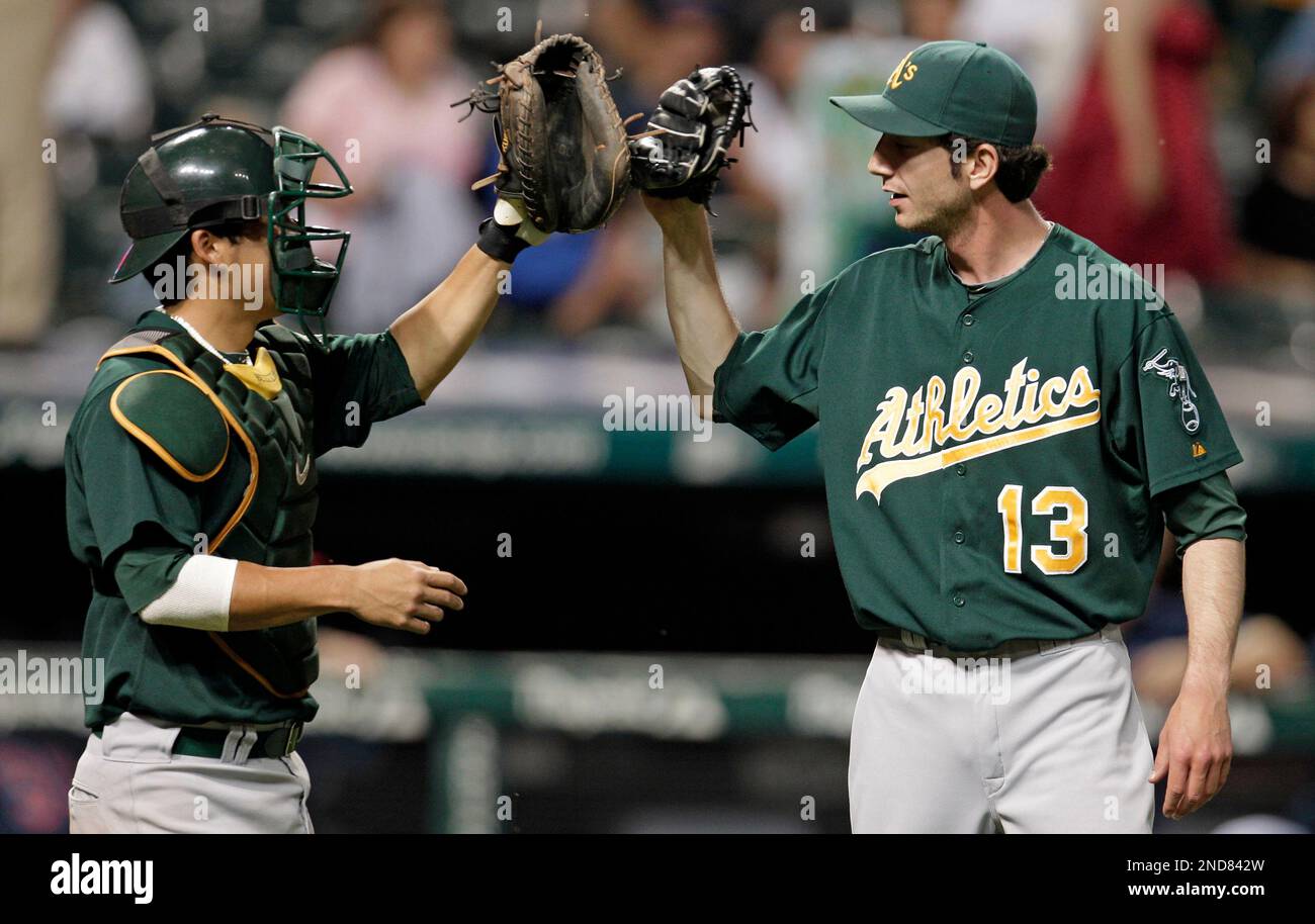 Oakland Athletics relief pitcher Jerry Blevins (13) is congratulated by ...