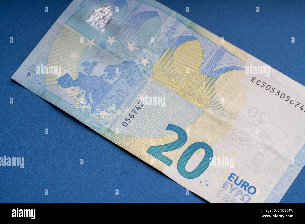20 euro banknote close up, blue background for business finance topics ...