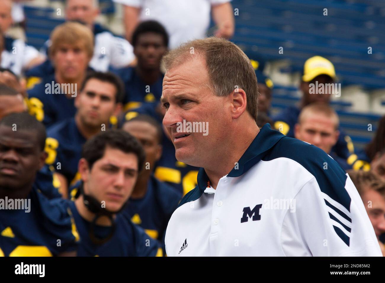 Michigan head coach Rich Rodriguez walks in front of his players after ...