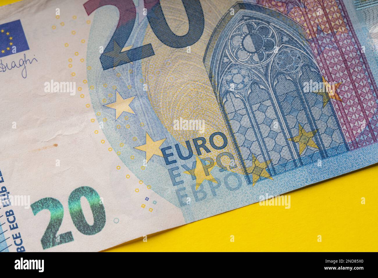 20 euro banknote close up, yellow background for business finance ...