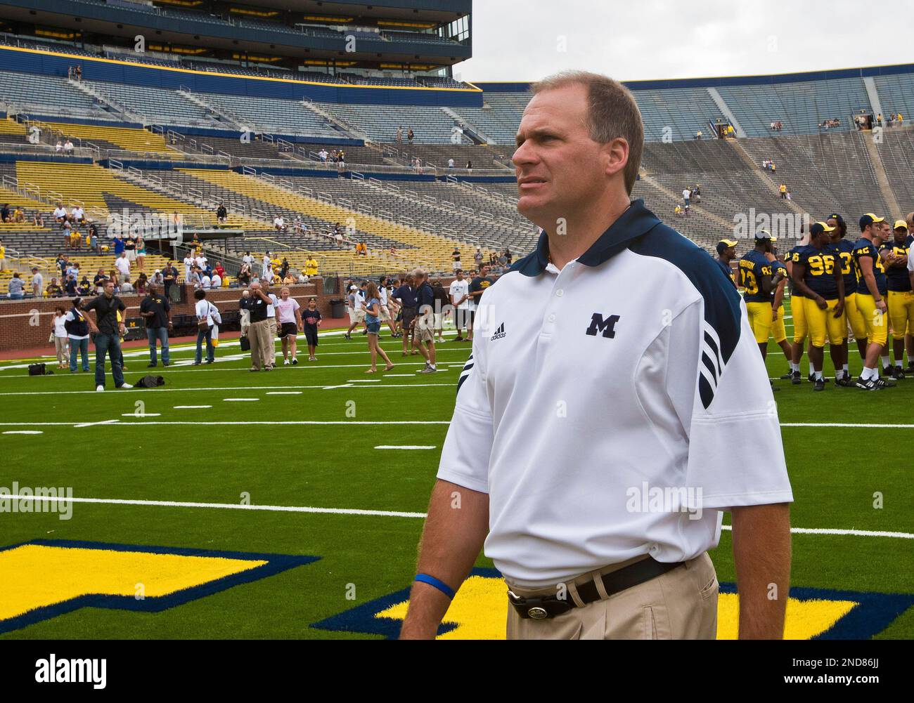 Michigan head coach Rich Rodriguez walks the Michigan Stadium field ...