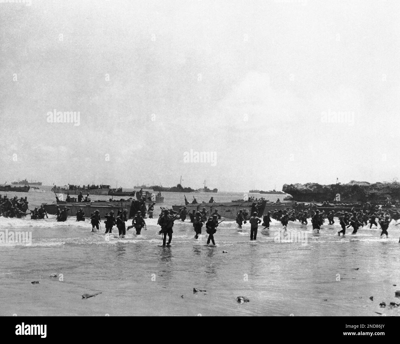 Troops of the U.S. Army 81st Infantry division swarm ashore at Angaur ...