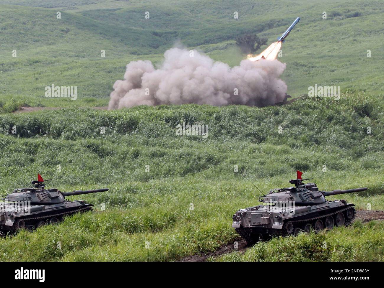 Japan Ground Self-Defense Force tanks take part in during an annual ...