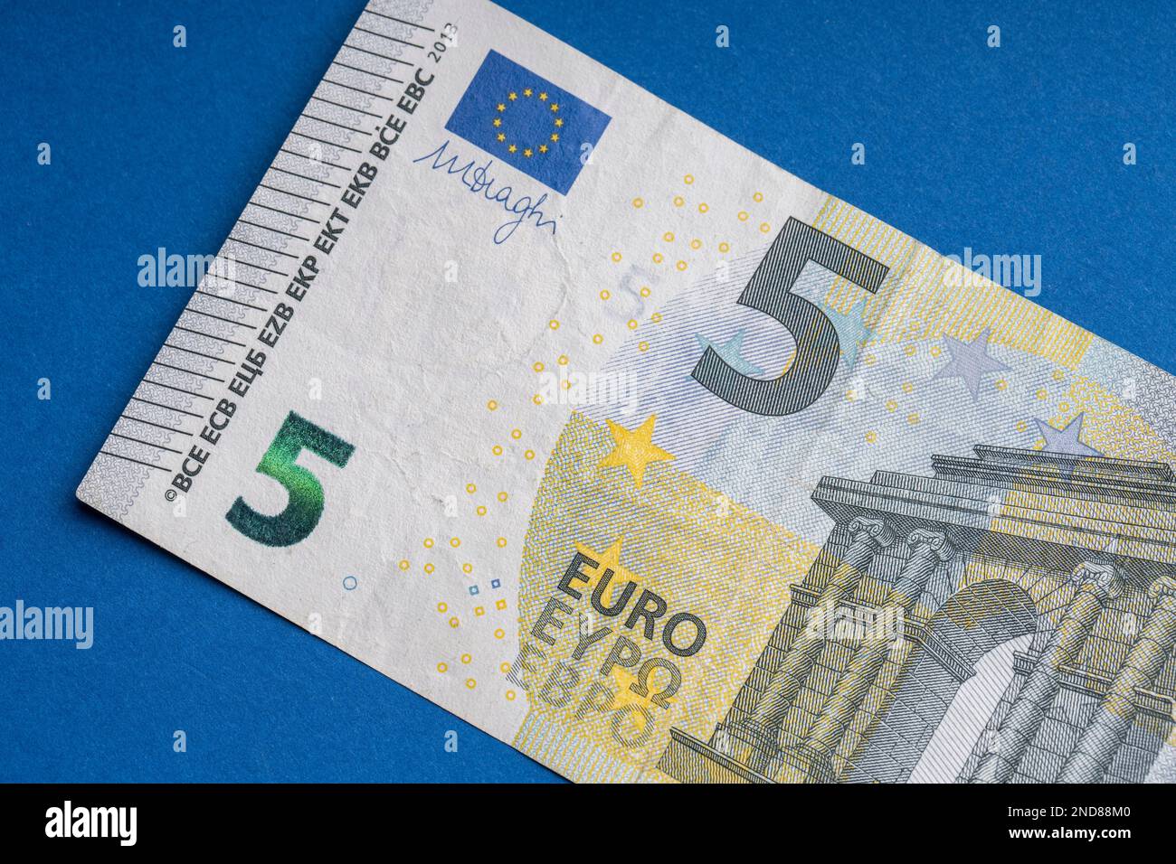 5 euro banknote close up, blue background for business finance topics ...