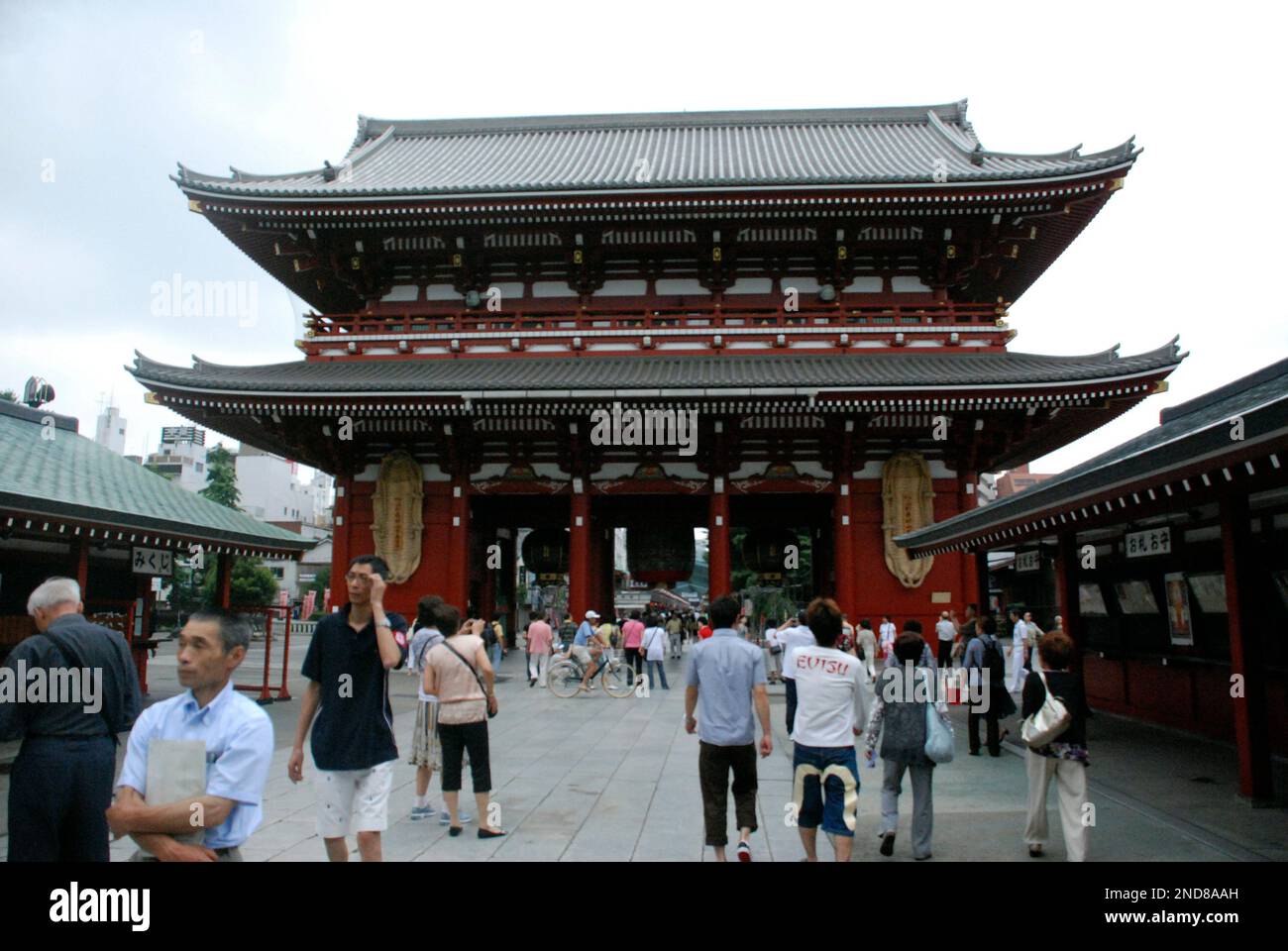 This July 3, 2010 photo shows pedestrians at the Asakusa temple in ...