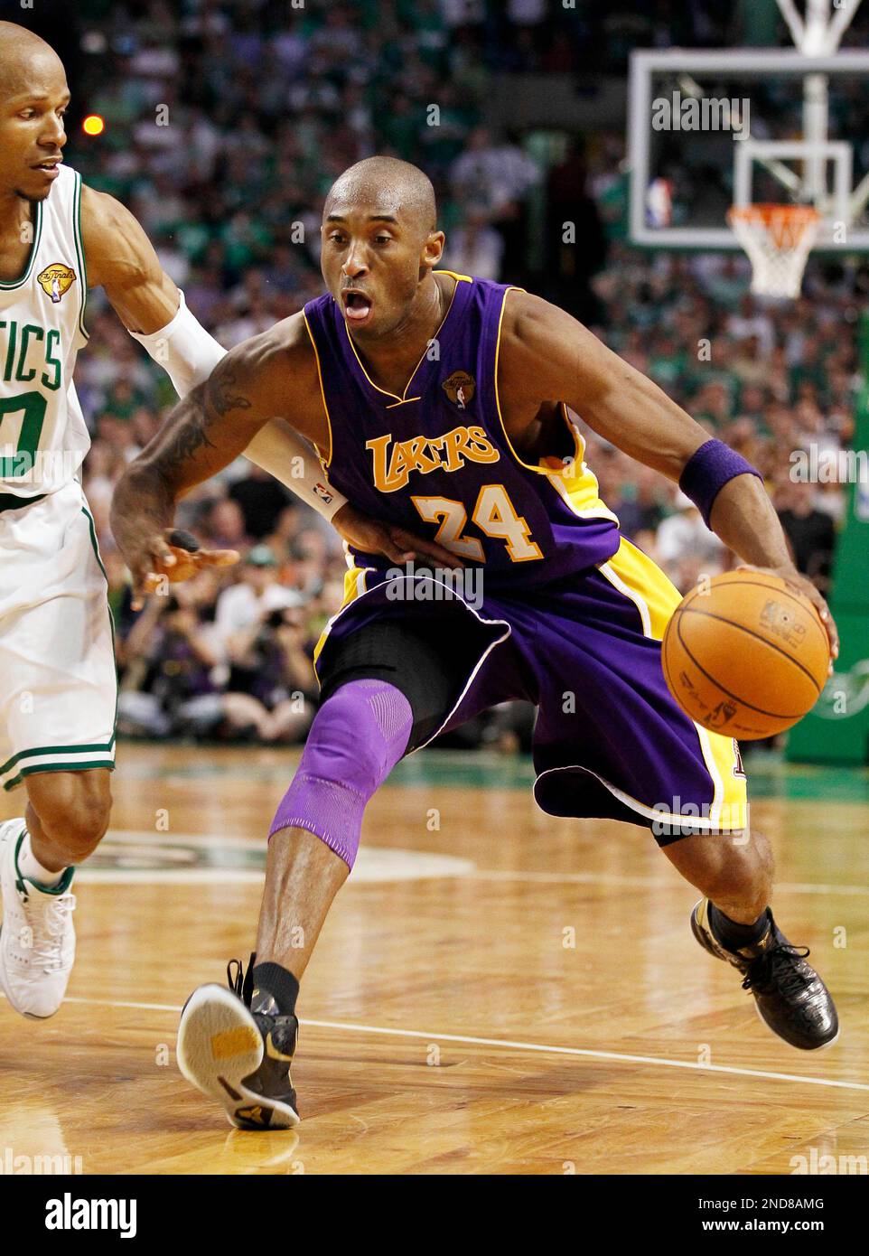 Los Angeles Lakers' Kobe Bryant drives on Boston Celtics' Ray Allen ...