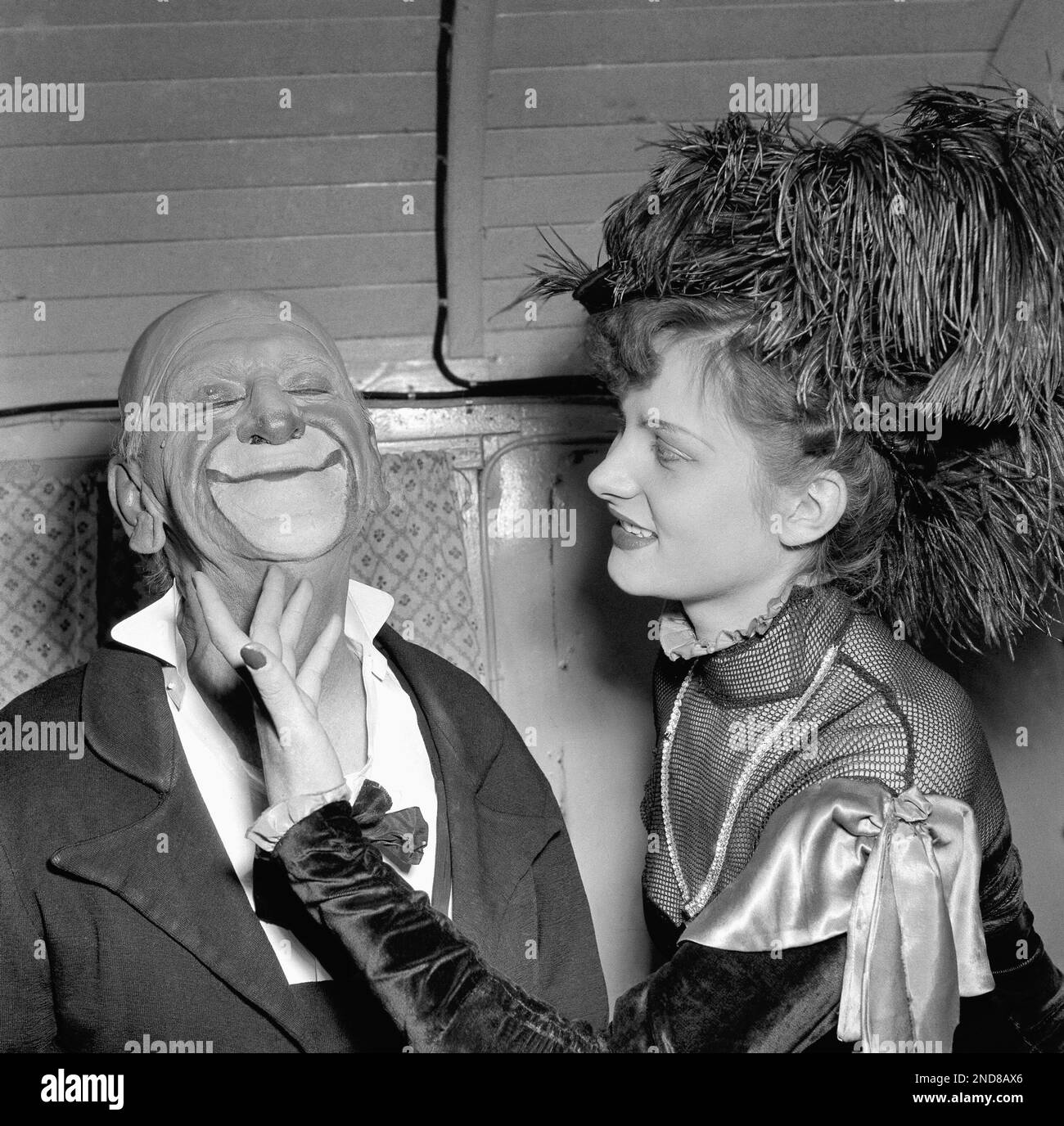 Grock, world-famous Swiss clown, gets a bit of encouragement from a ...