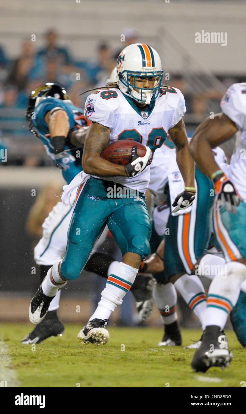 Miami Dolphins cornerback Nolan Carroll (28) returns a kick during an ...