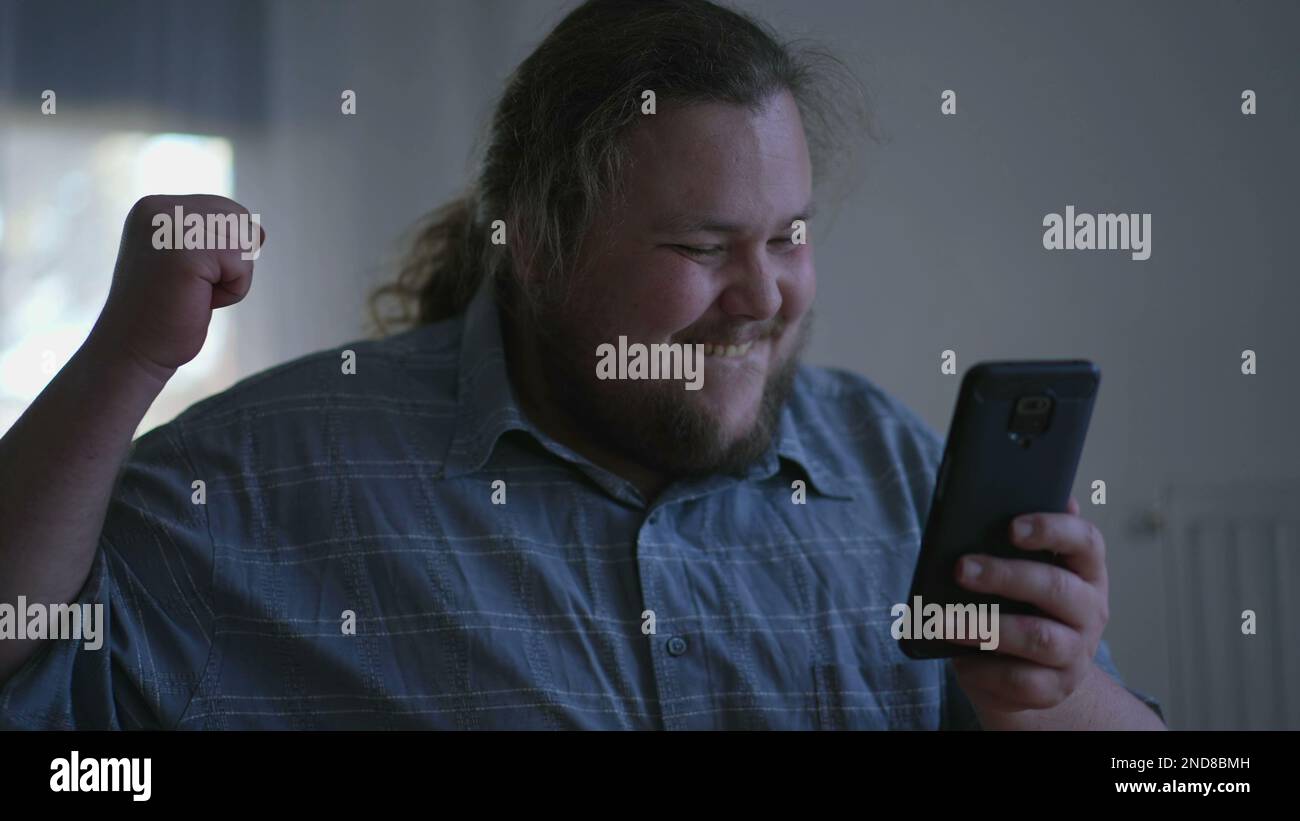 One excited fat man celebrates hi-res stock photography and images - Alamy