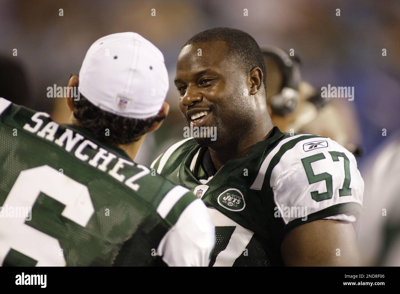 New York Jets' Bart Scott (57) talks with Mark Sanchez on the sidelines ...