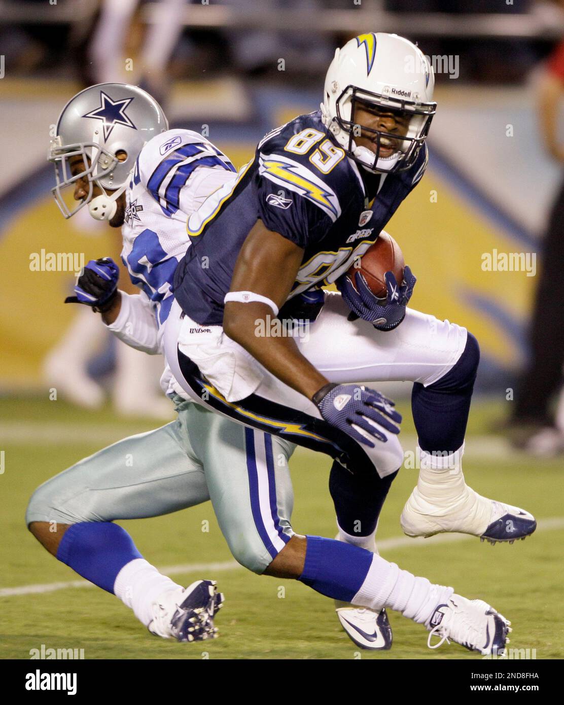 San Diego Chargers wide receiver Seyi Ajirotutu, right, runs around ...
