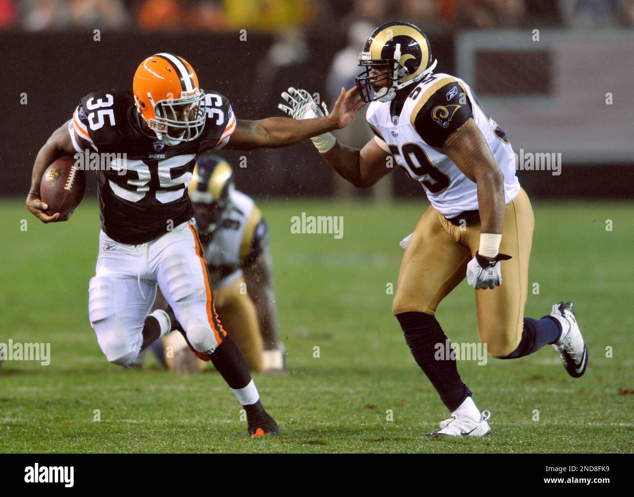Cleveland Browns running back Jerome Harrison (35) wards off St. Louis ...