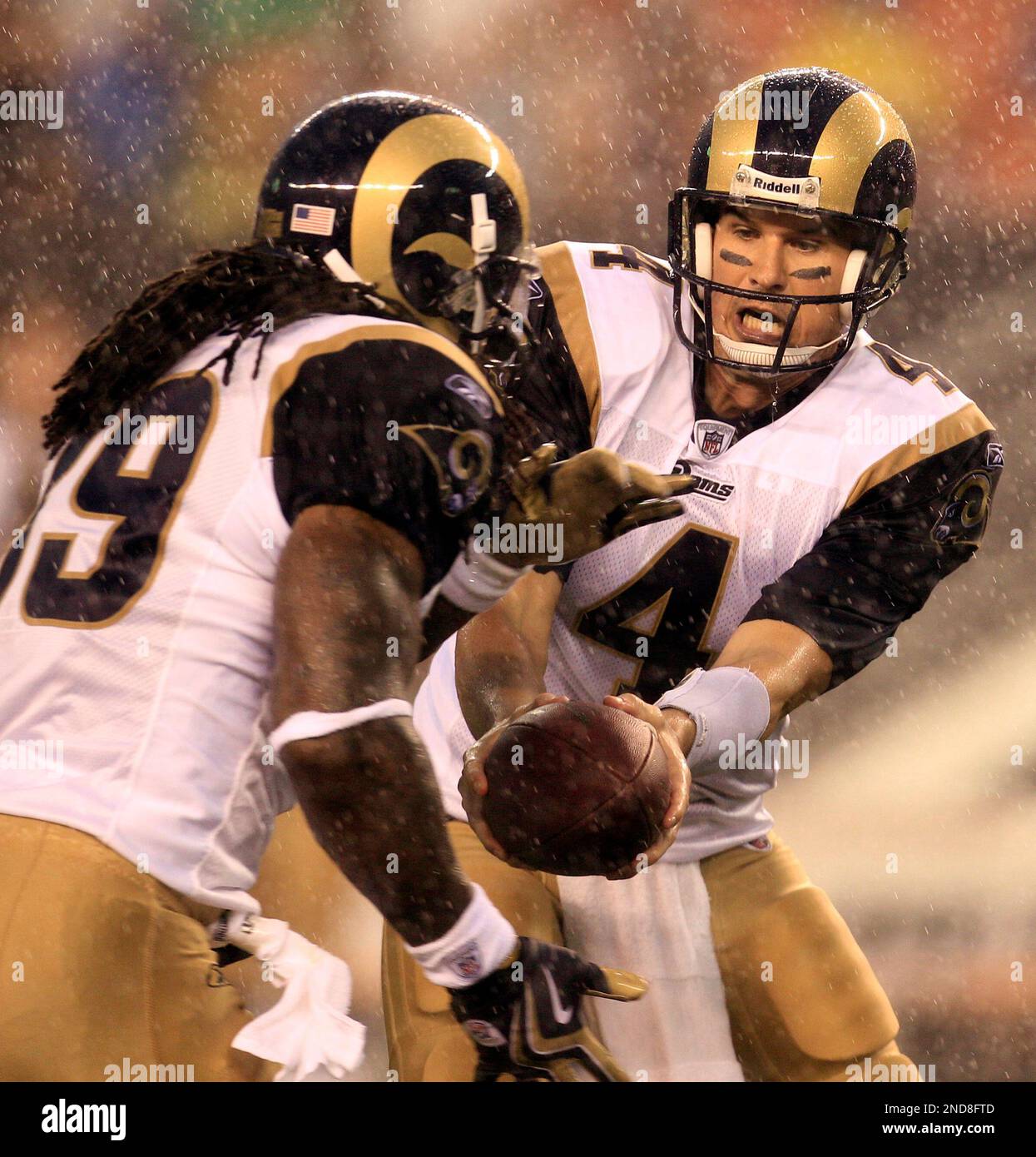St. Louis Rams quarterback A.J. Feeley, right, passes the ball in the ...