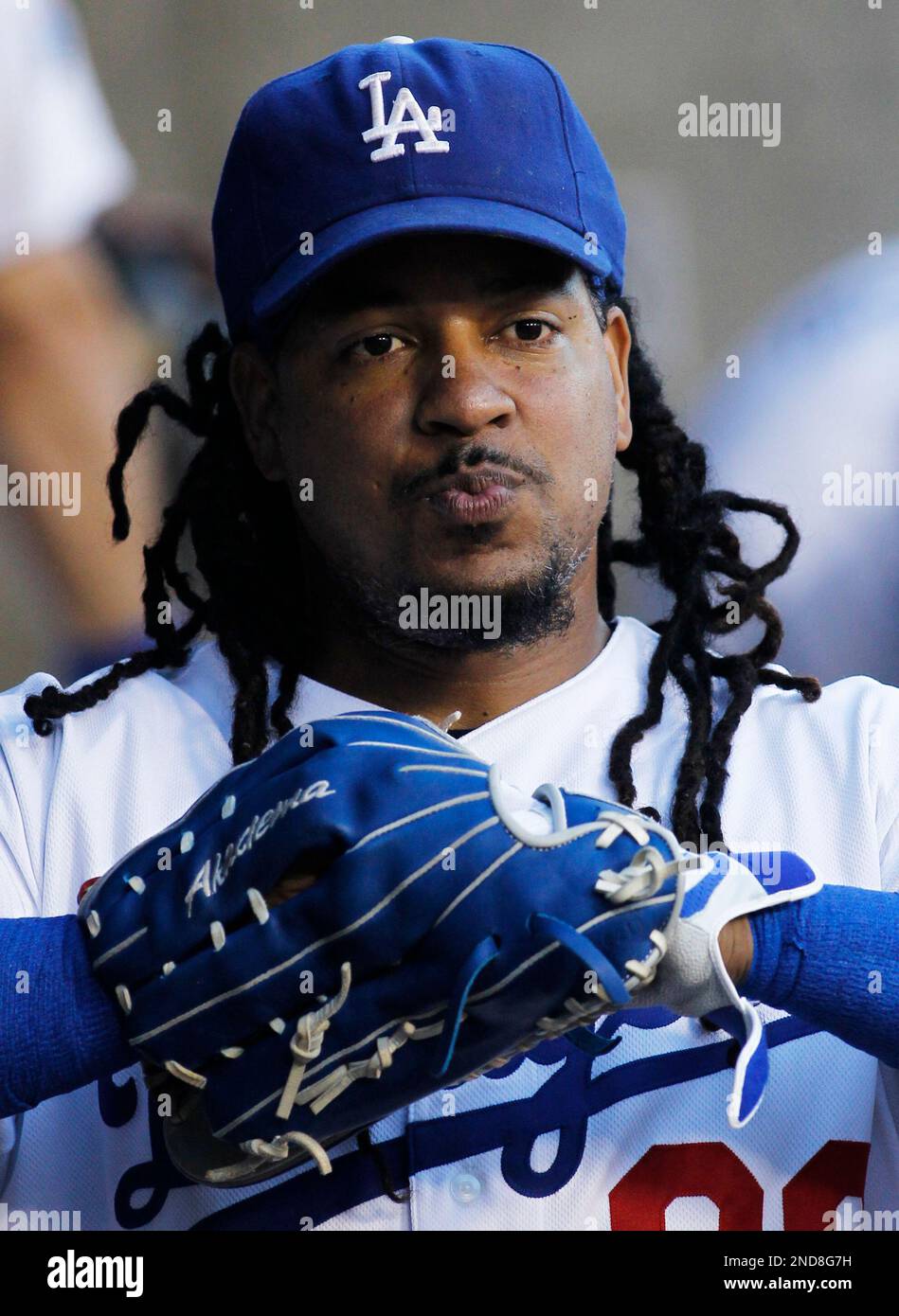 Los Angeles Dodgers' Manny Ramirez prepares in the dugout before ...