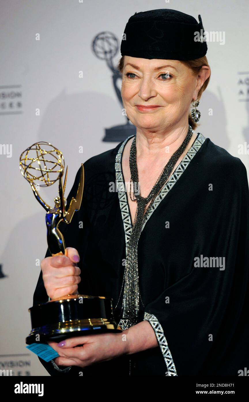Joan Bergin poses in the press room with the award for outstanding ...