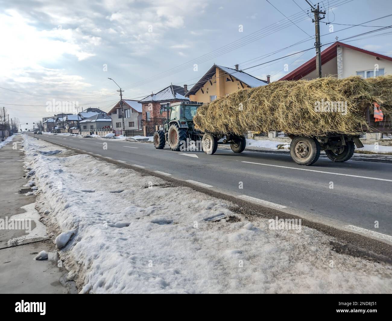 a tractor pulls a trailer loaded with hay - Maramures, Romania Stock ...