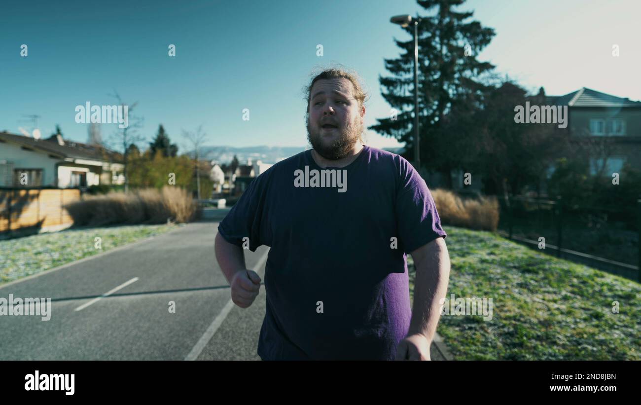 Happy man dancing in street. A cheerful fat chubby guy dancer ...