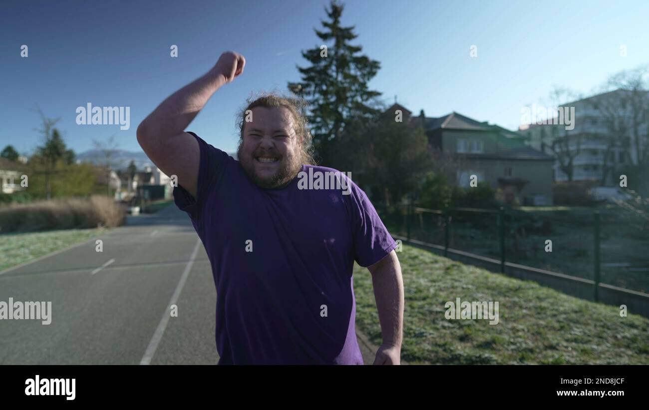 One ecstatic young fat man feeling joy. Happy person celebrating ...