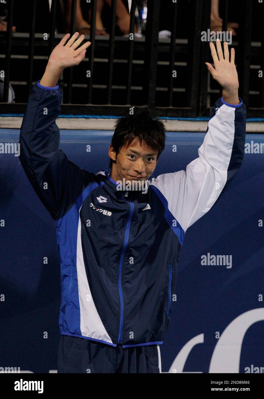Bronze medalist Ryosuke Irie, of Japan, waves during the medal ceremony ...