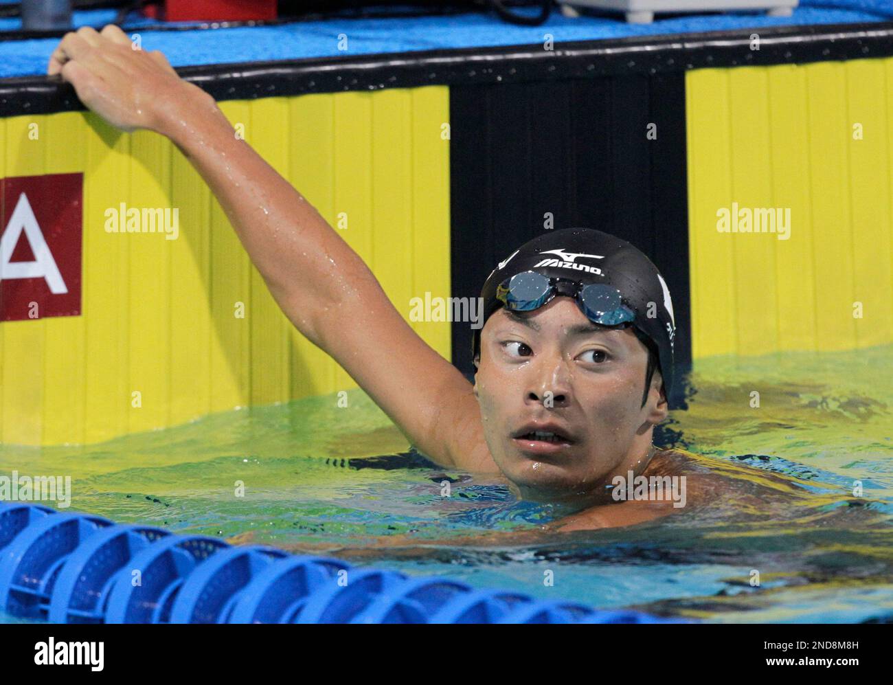 Ryosuke Irie, of Japan, looks at the results after competing in the men ...