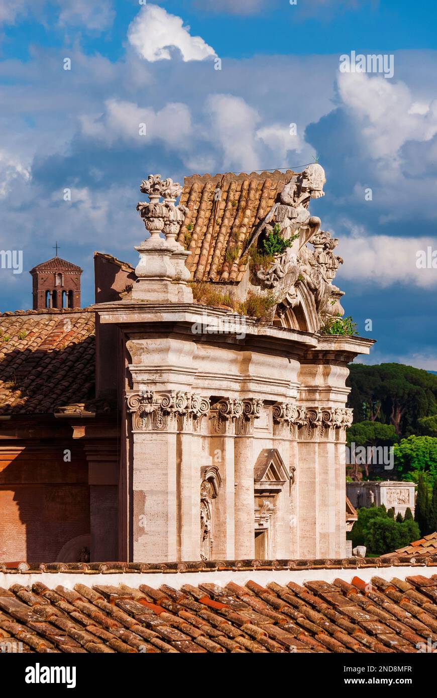 Old architectures in Rome. Baroque church facade, medieval bell tower ...