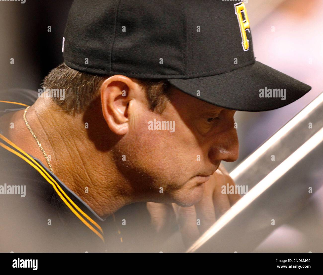 Pittsburgh Pirates manager John Russell leans on the dugout stairs ...