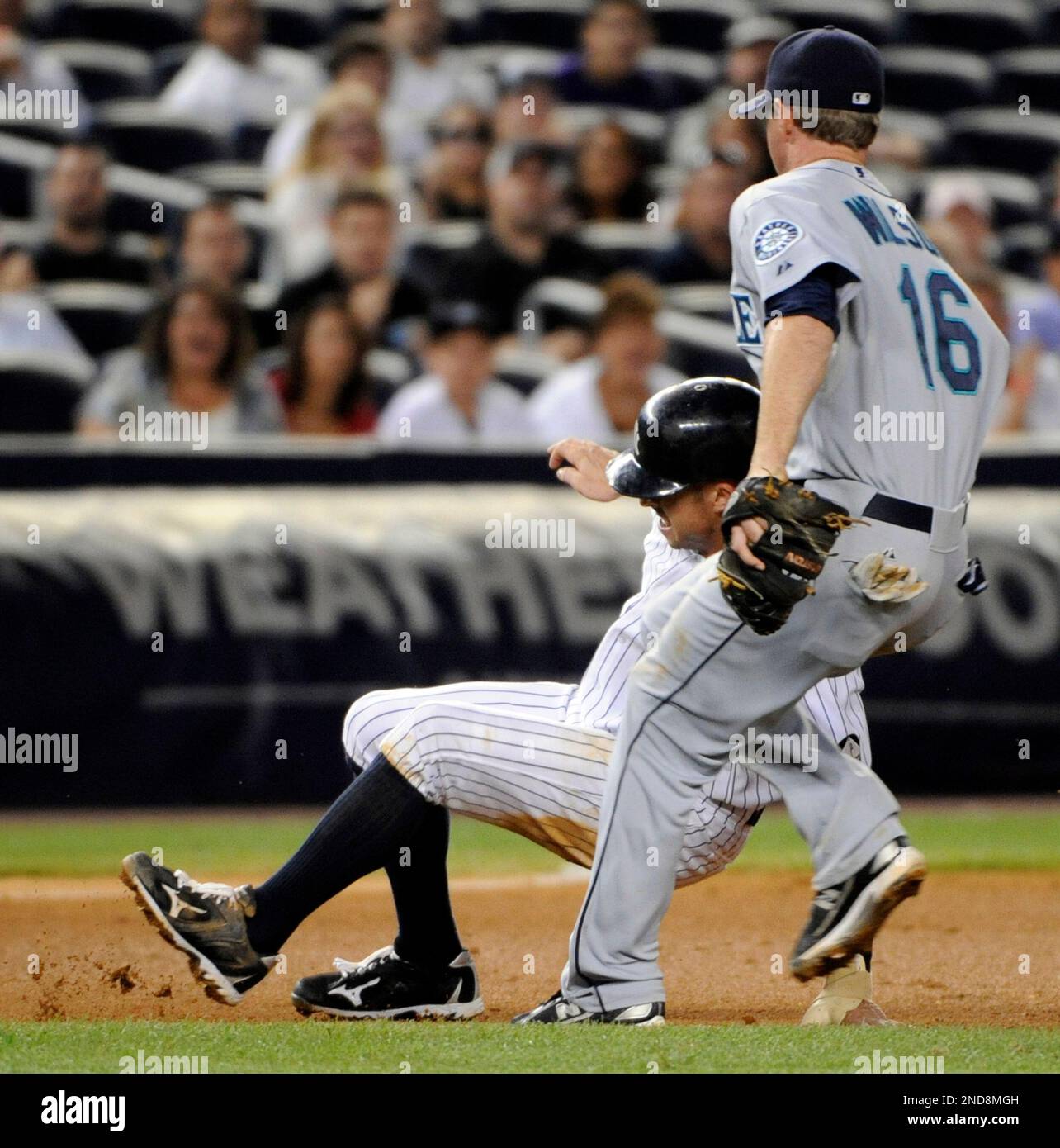 New York Yankees' Brett Gardner, left, is tagged out by Seattle ...