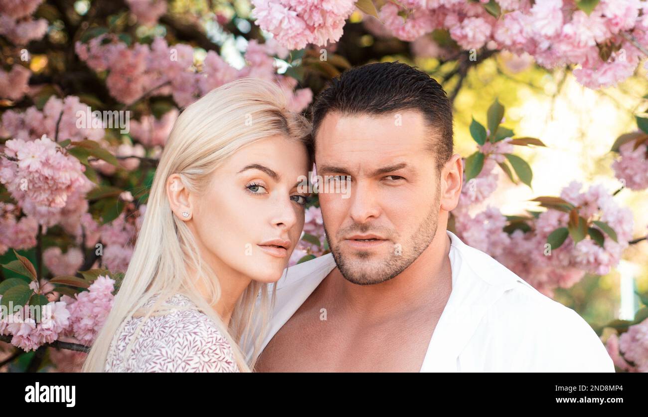 Spring couple in love, banner. Spring couple in love walking in sakura ...