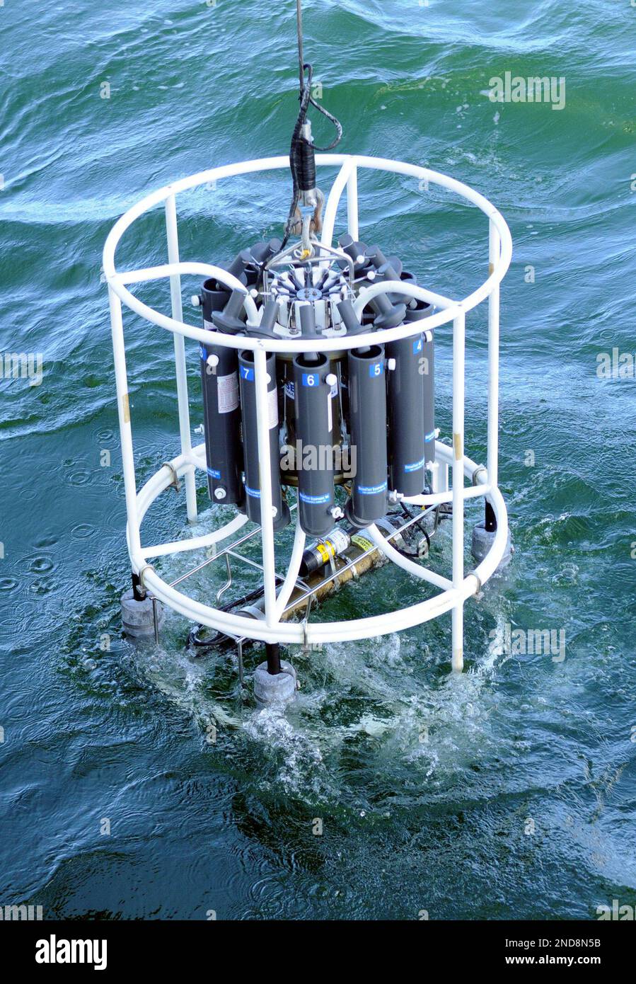 A water column sampler slowly slides into the Gulf of Mexico from NOAA ...