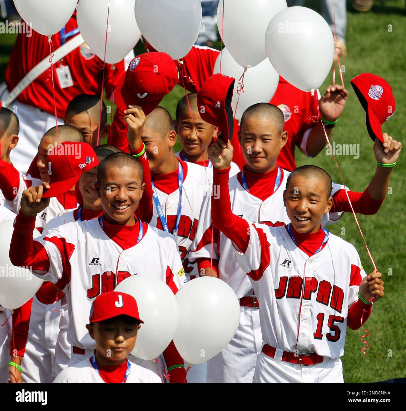 The Little League team representing Japan, from Tokyo, marches in the ...