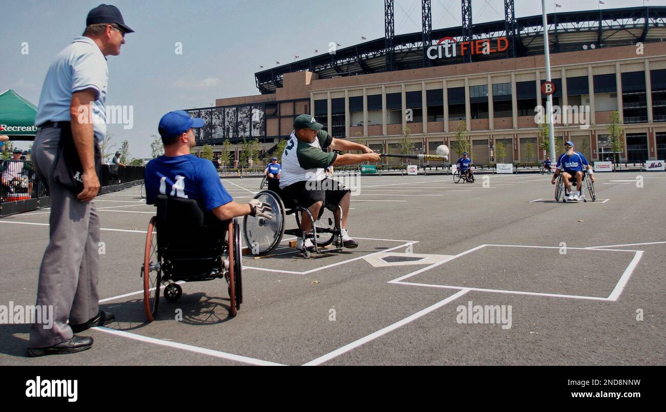Left fielder Donovan Hoffman, center, of the Flame Throwers, from ...