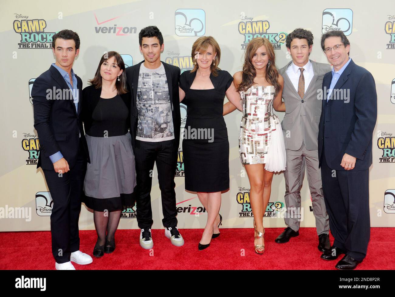 From left, actor Kevin Jonas, Disney Channels Worldwide president ...