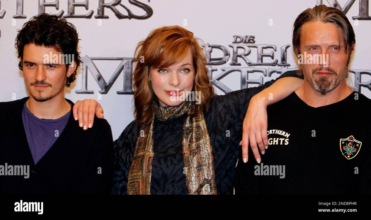 From left, actors Orlando Bloom, Milla Jovovich and Mads Mikkelsen pose ...