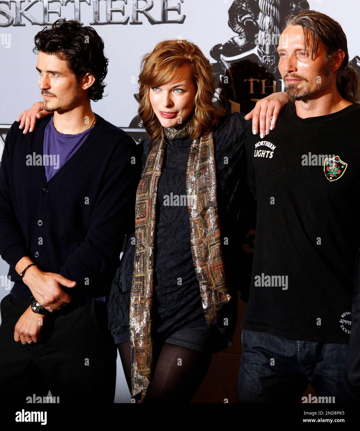 From left to right, actors Orlando Bloom, Milla Jovovich and Mads ...