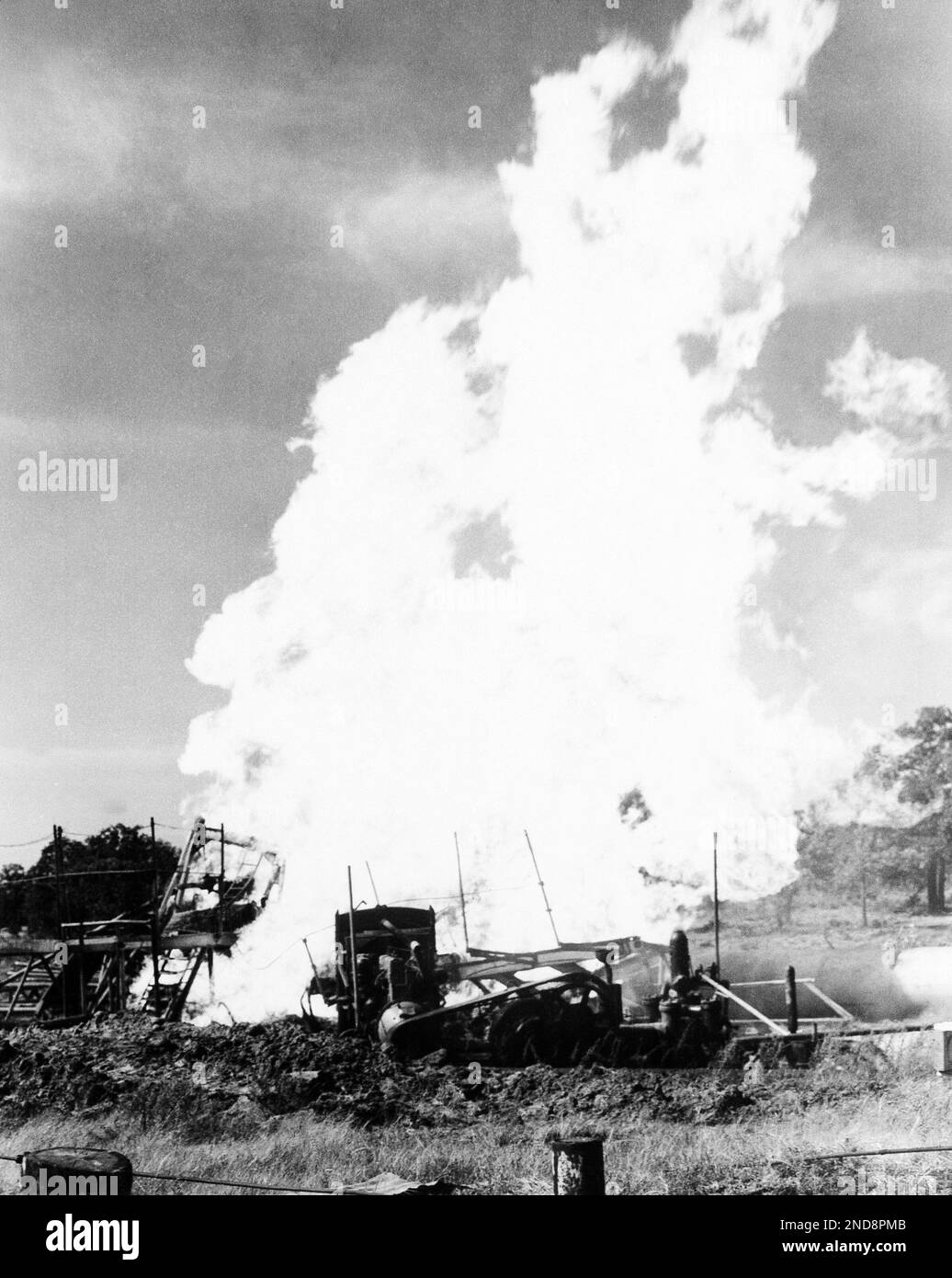 Roaring flames leap into the air over a gas well near Velma, Oklahoma ...