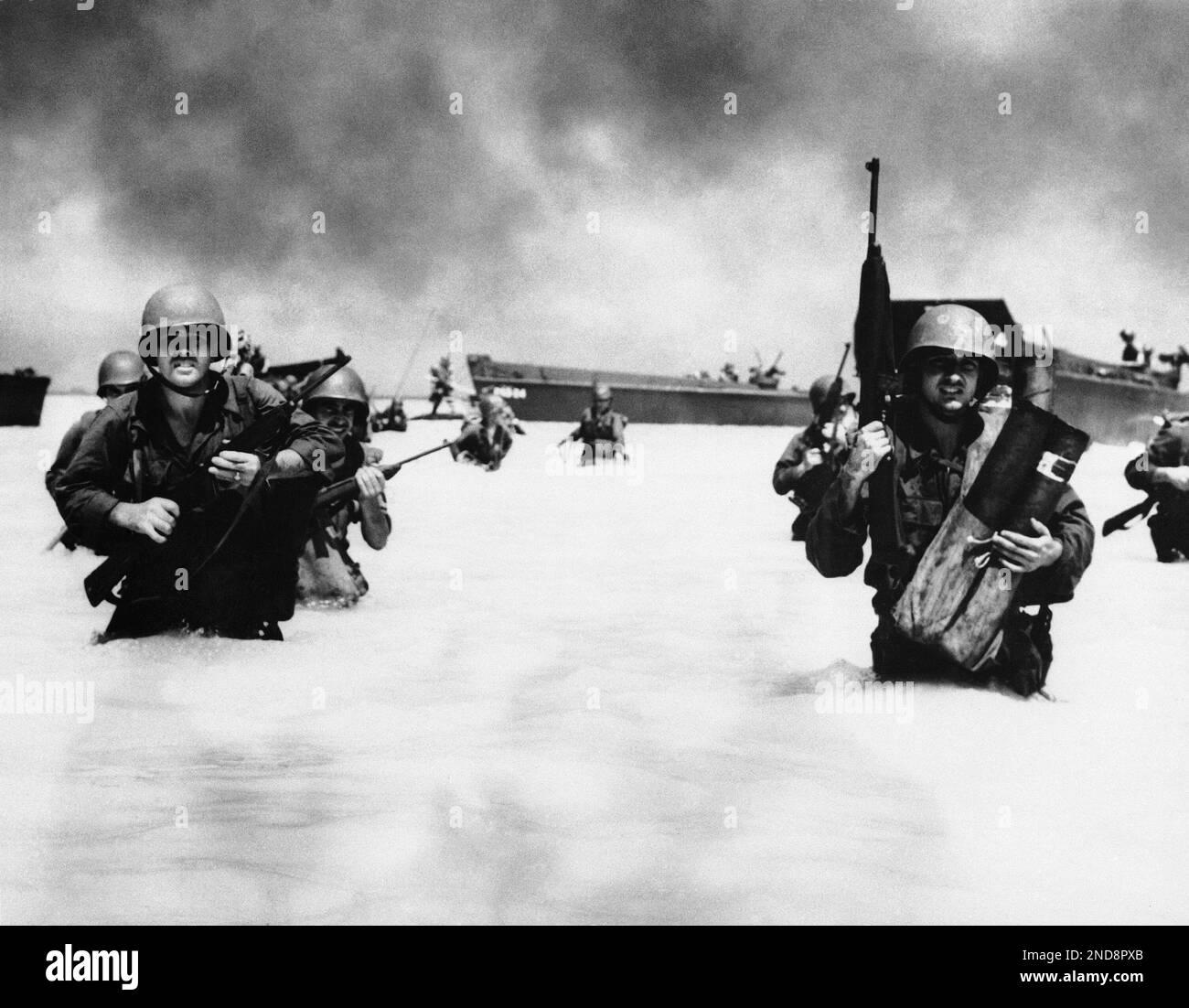 Under heavy fire from Japanense machine guns hidden in hulk on their ...