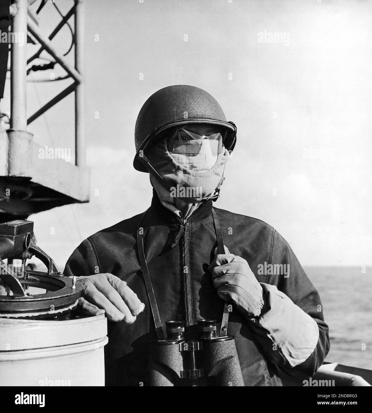 A chief Yeoman of the U.S. Navy wears a special suit, gloves and mask ...