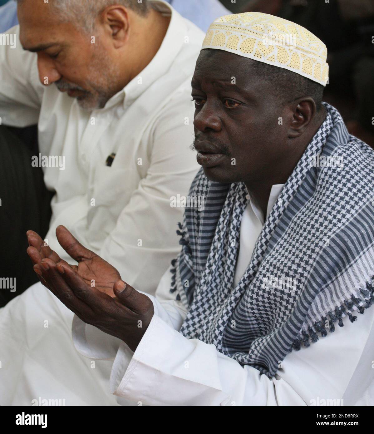 A Kenyan Muslim offers his prayers during the second Friday of the holy ...