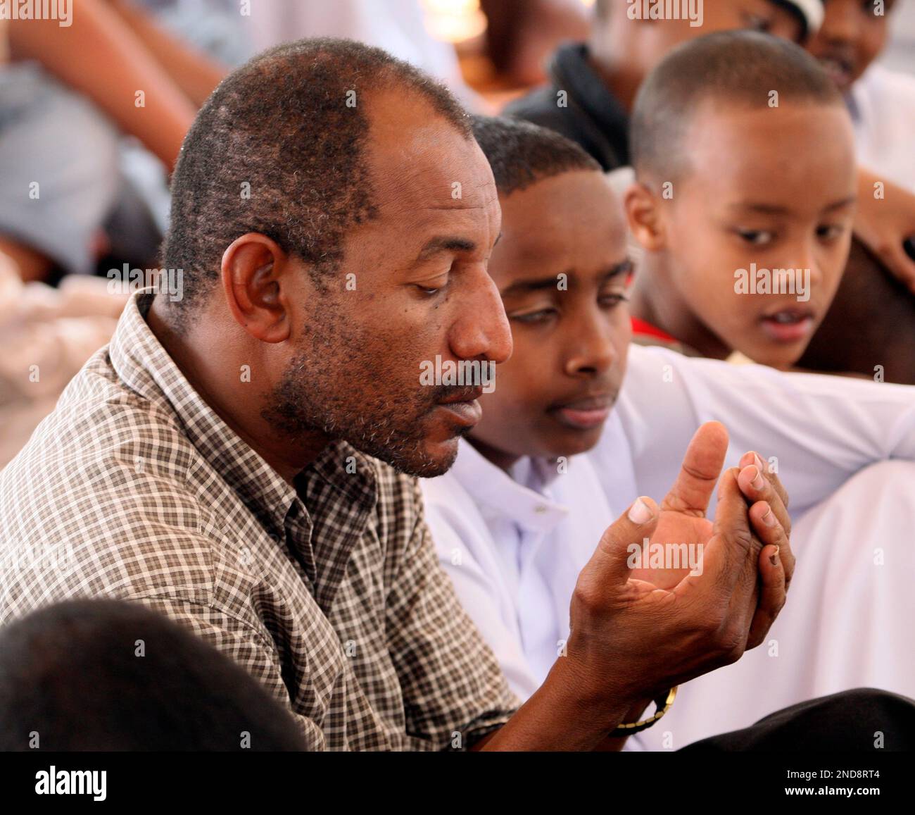 A Kenyan Muslim offers his prayers during the second Friday of the holy ...