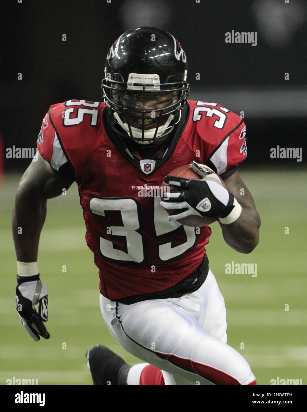 Atlanta Falcons running back Antone Smith (35) looks for yardage in the ...