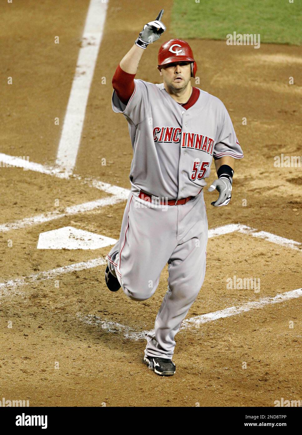 Cincinnati Reds catcher Ramon Hernandez points upward after hitting a ...