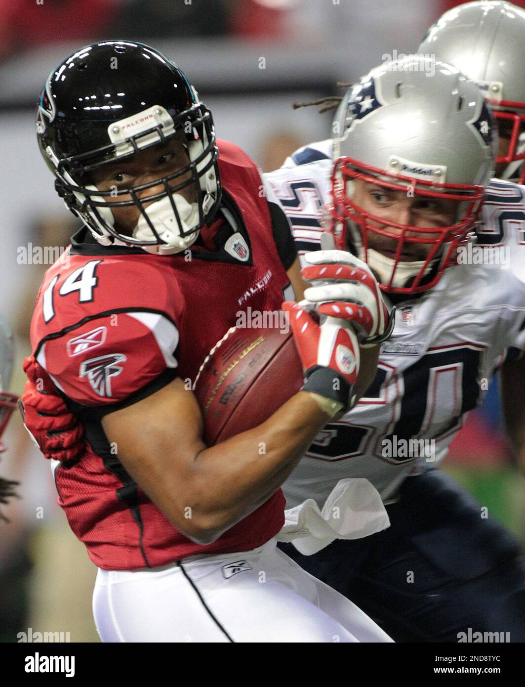 Atlanta Falcons receiver Eric Weems (14) spins away from New England ...