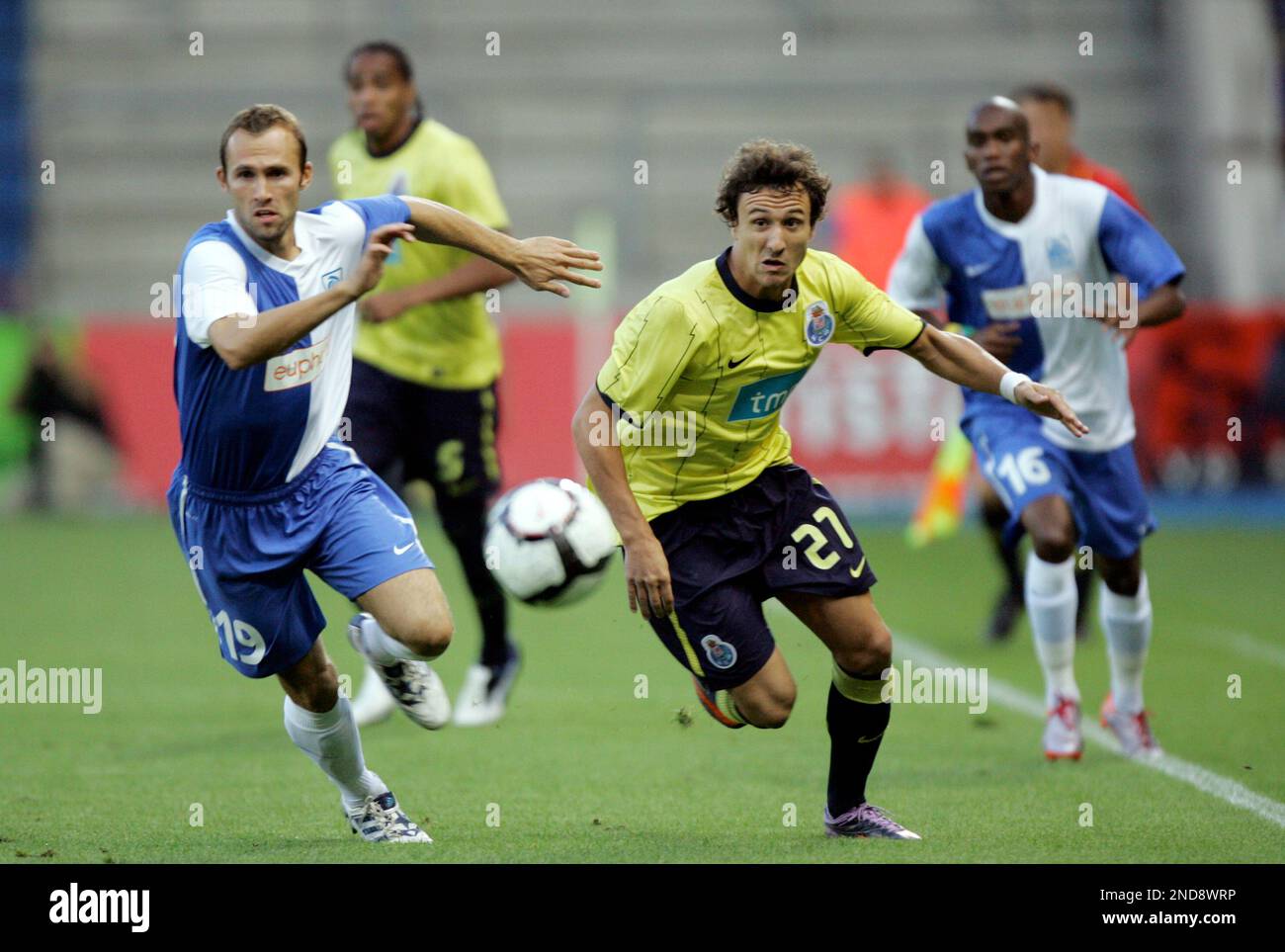 KRC Genk player Thomas Buffel, left, challenges FC Porto player ...