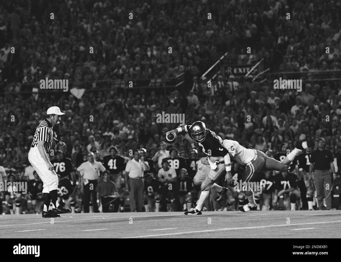 Notre Dame quarterback Tom Clements (2) gets dumped again by Nebraska’s ...