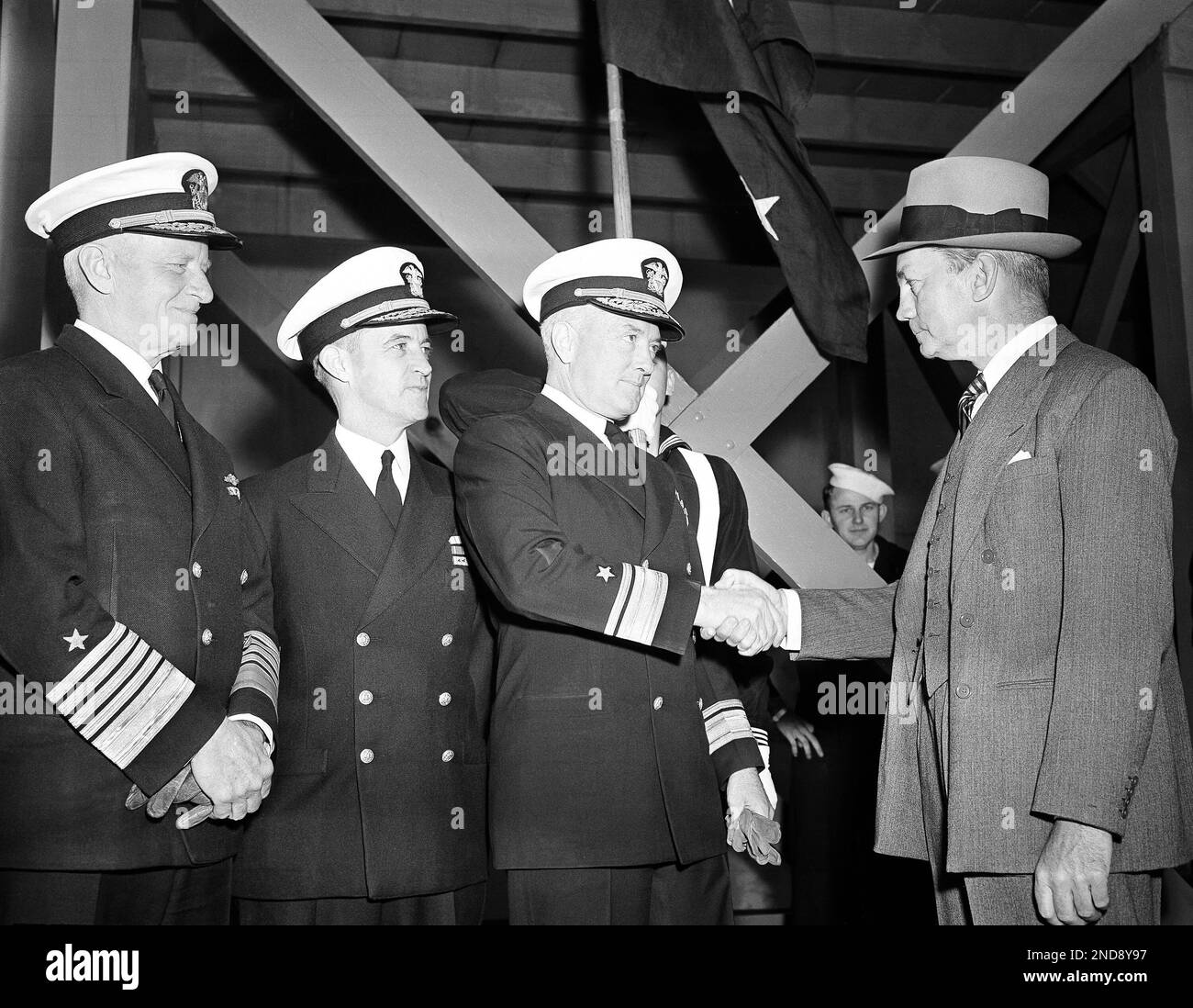 Secretary of the navy James Forrestal (right) greets rear admirals ...