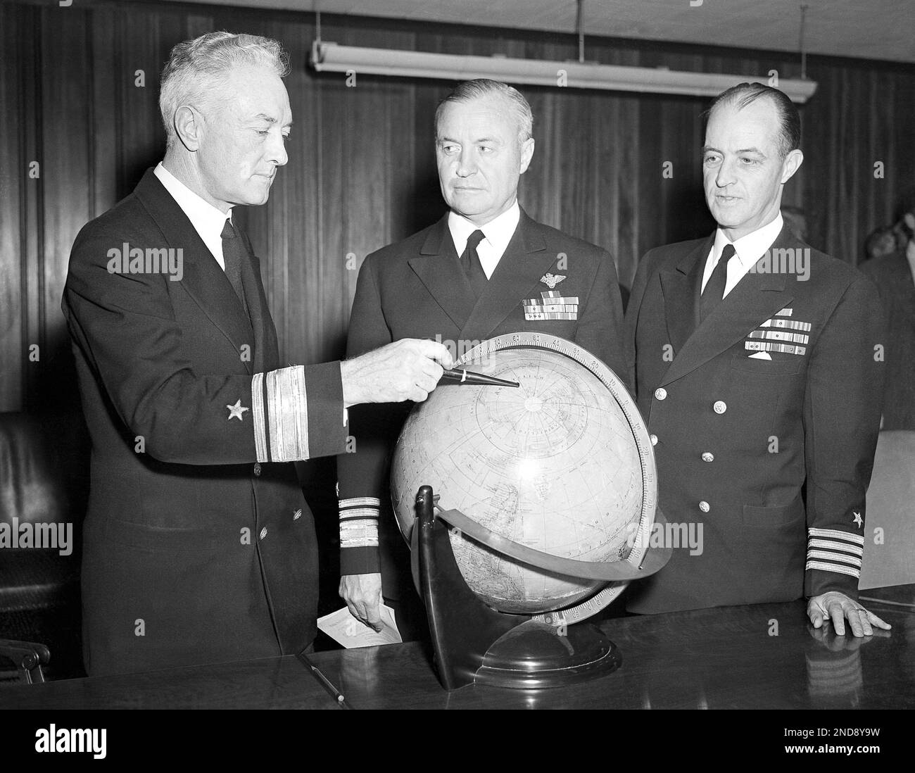 Rear Adm. Richard Evelyn Byrd (left) uses a pipe as a pointer in ...