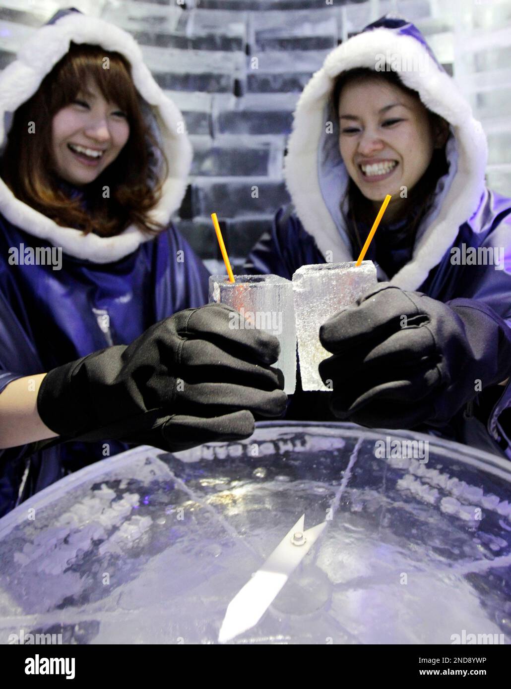 Visitors toast at Icebar Tokyo, Thursday, Aug 19, 2010. Nearly 180 ...
