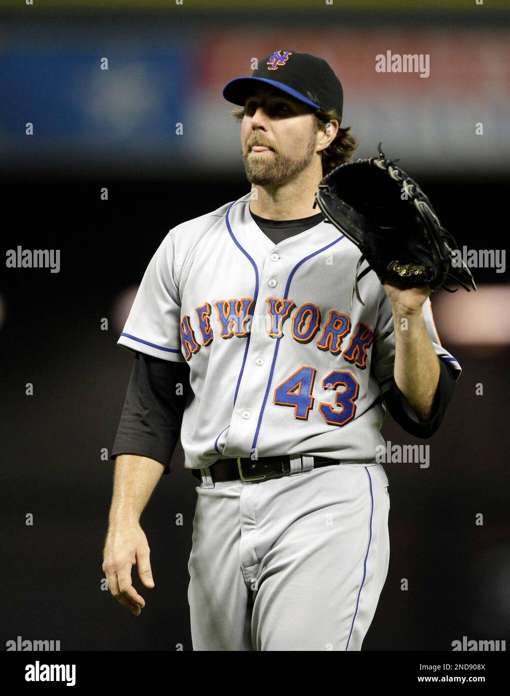 New York Mets pitcher R.A. Dickey waits for a new ball after giving up ...